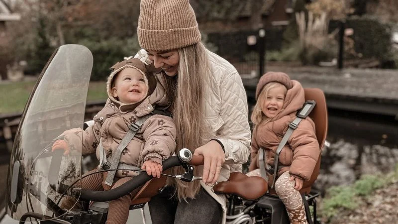 Esmee and her daughters on a bike